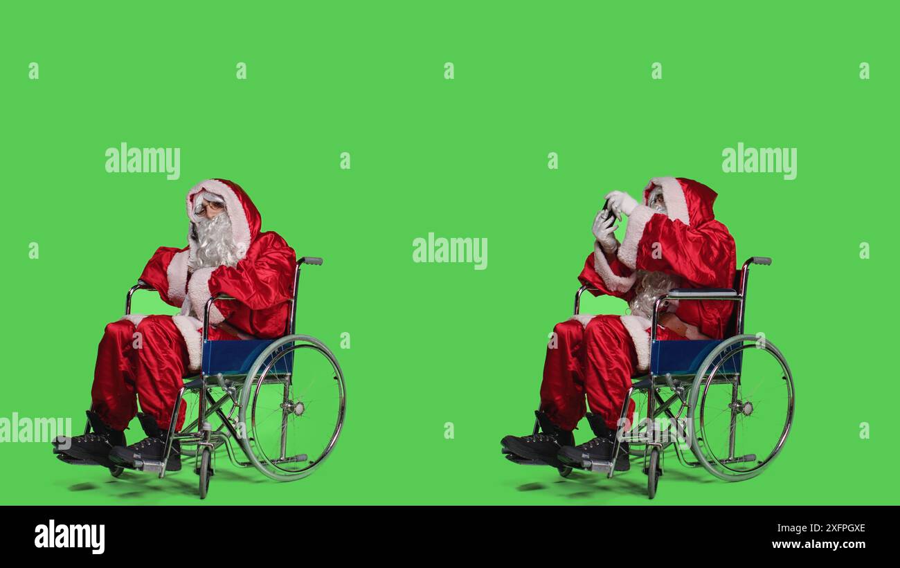 Man on phone call and playing videogames while he sits in wheelchair ...