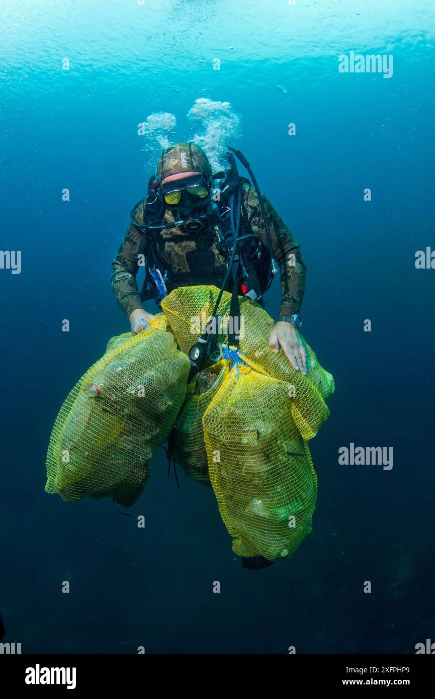Scuba diver removing plastic marine litter from the sea bed. Mljet ...