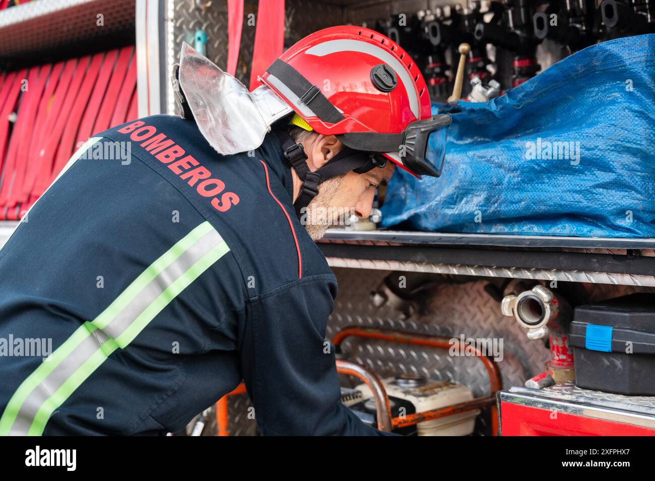 Firefighter check and maintenance equipment for working in area of fireplace office near fire ...