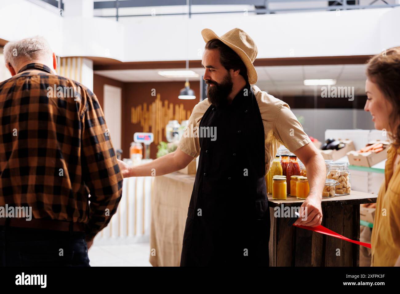 Newly opened zero waste shop owner inviting clients in after preparing ...