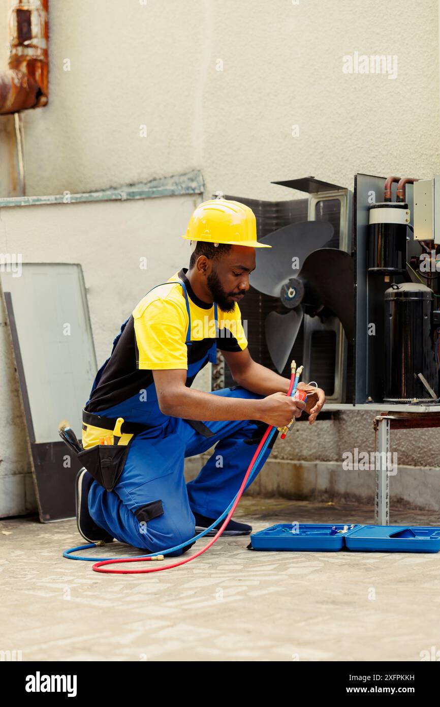 Knowleadgeable engineer doing annual hvac system maintenance ...