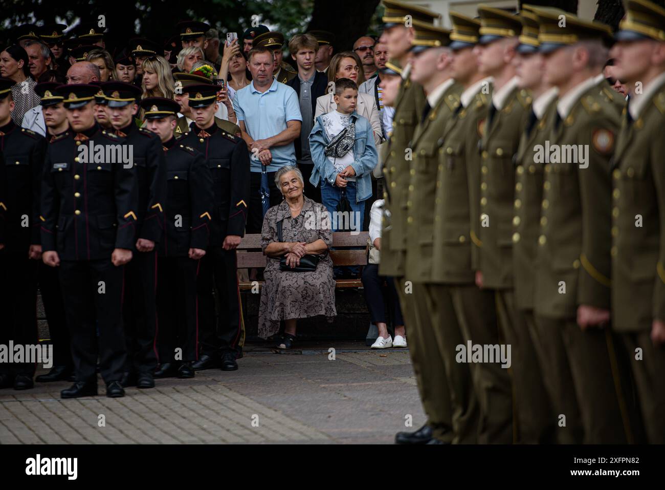 Spectators watch the ceremony of conferring lieutenant ranks on ...