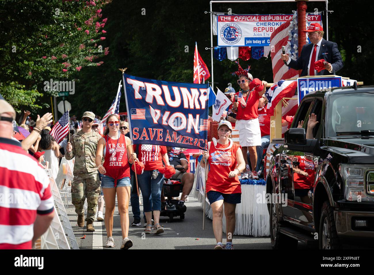 Woodstock, Georgia, USA. 4th July, 2024. Donald Trump supporters march ...