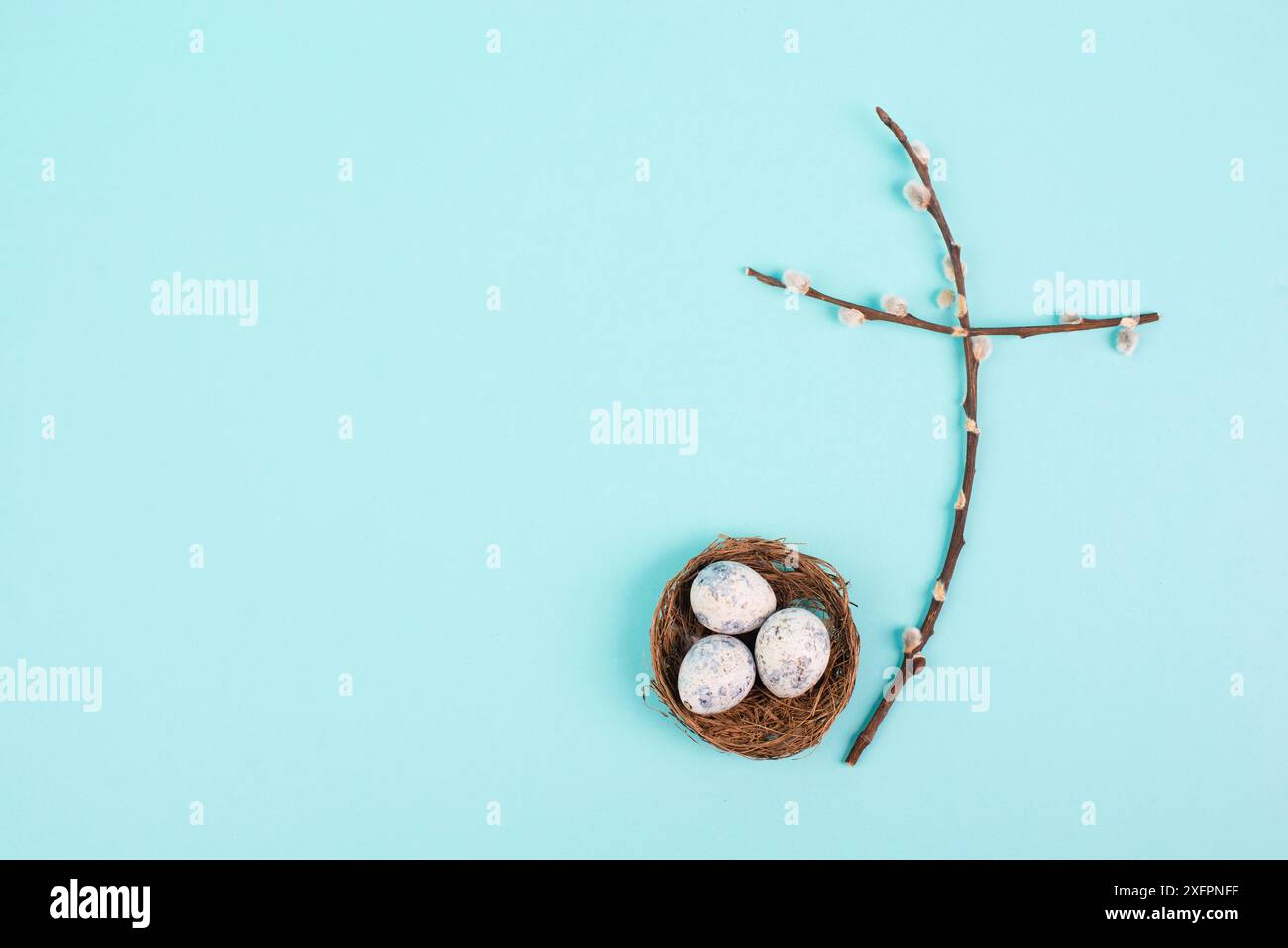 Religious cross made from willow branches, easter nest with eggs ...