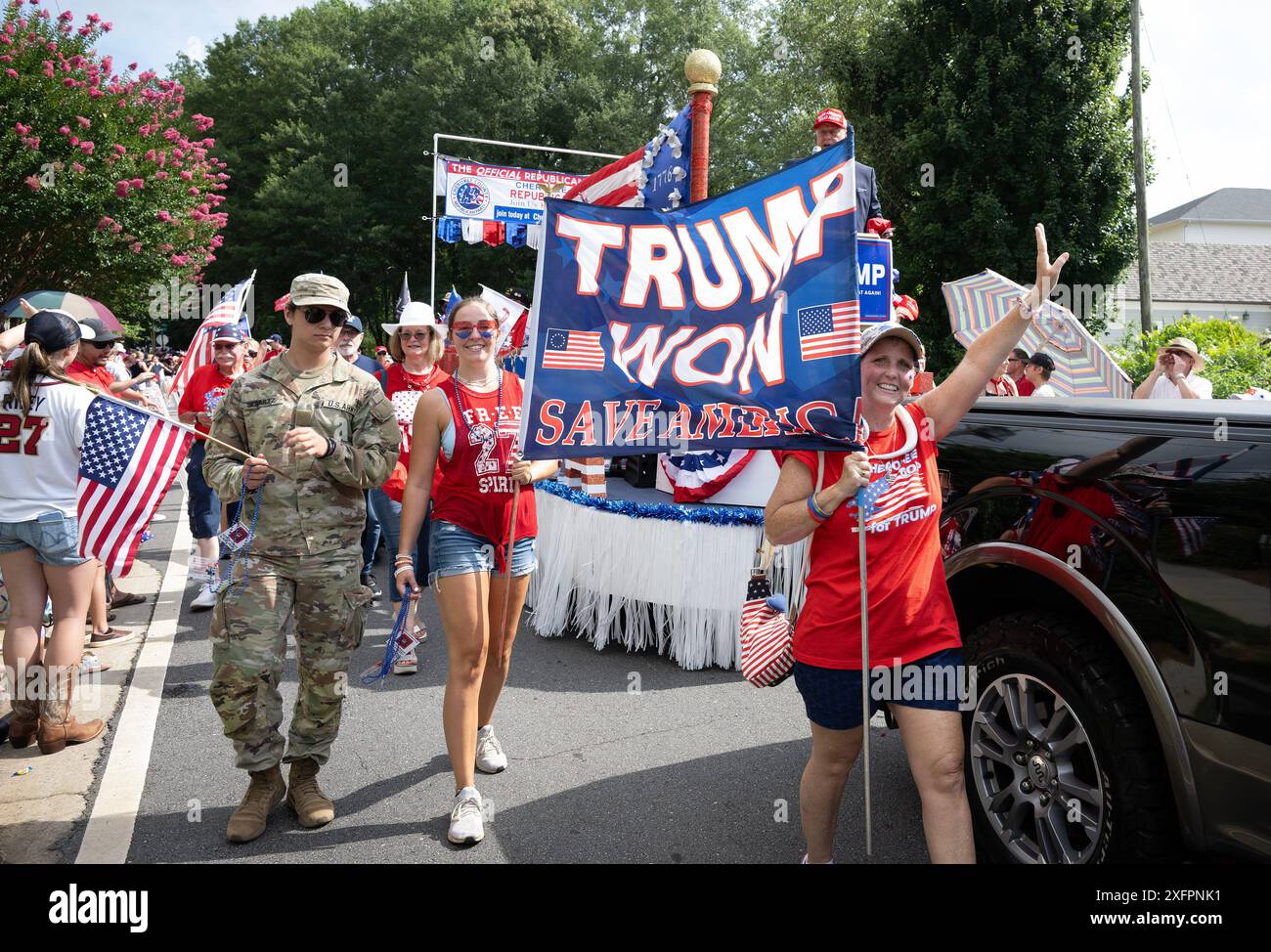 Woodstock, Georgia, USA. 4th July, 2024. Donald Trump supporters march ...