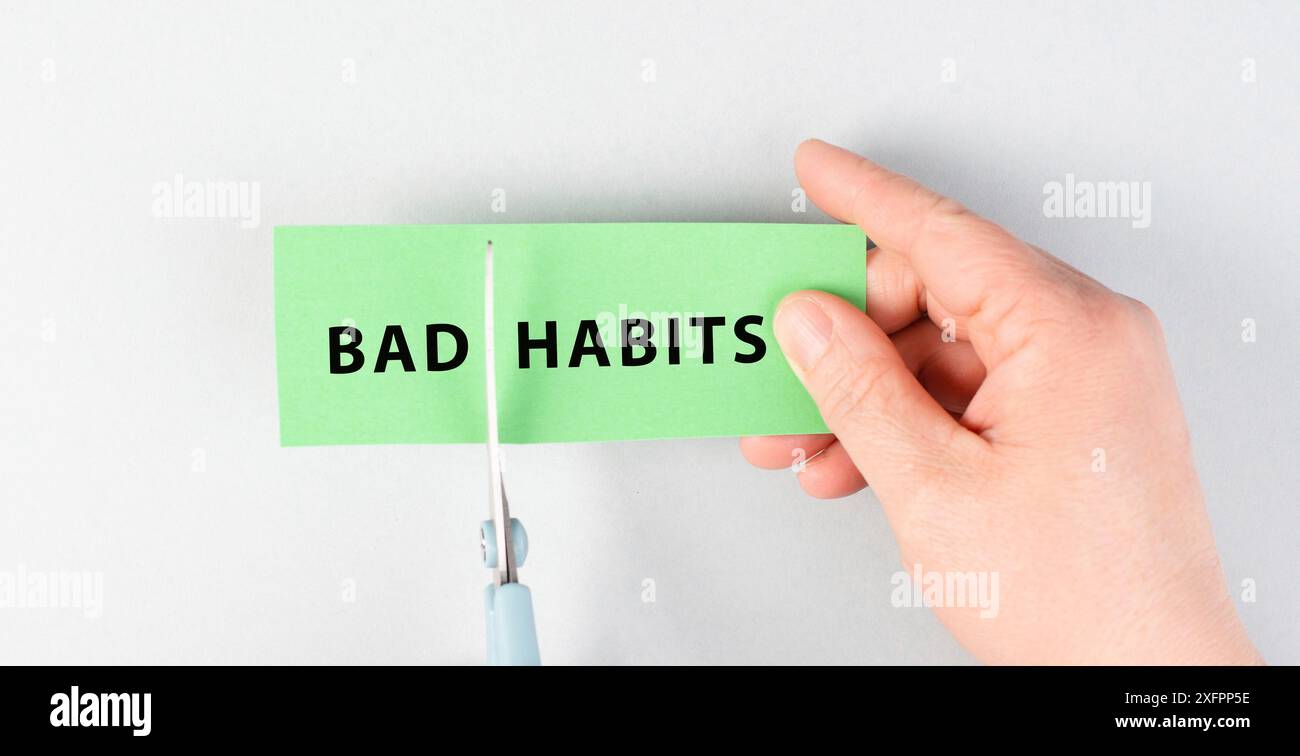 Bad habits sign cut with scissors, break a habit, stop smoking, quit ...