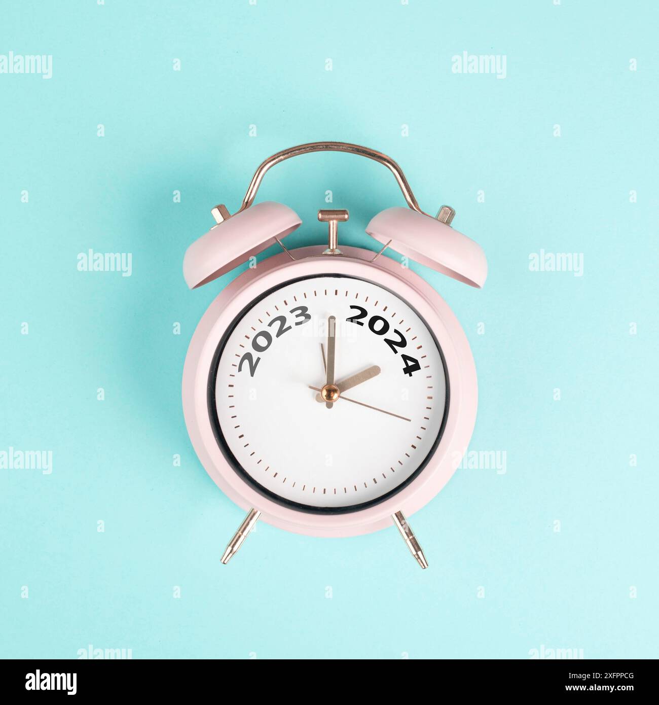 New year 2024 is loading, calendar date on an alarm clock, end of the ...