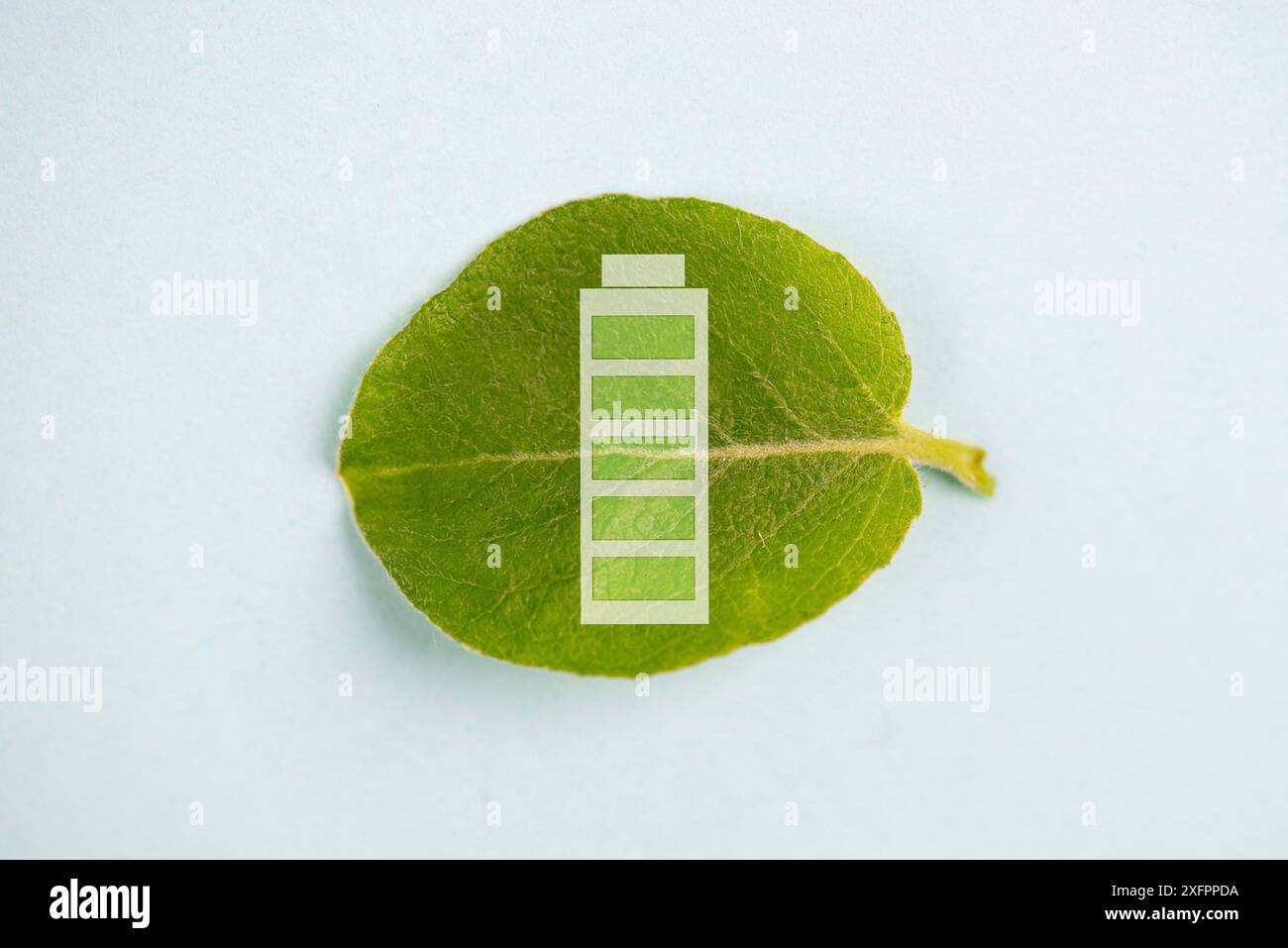 Green energy battery on a leaf, sustainable renewable electricity power ...
