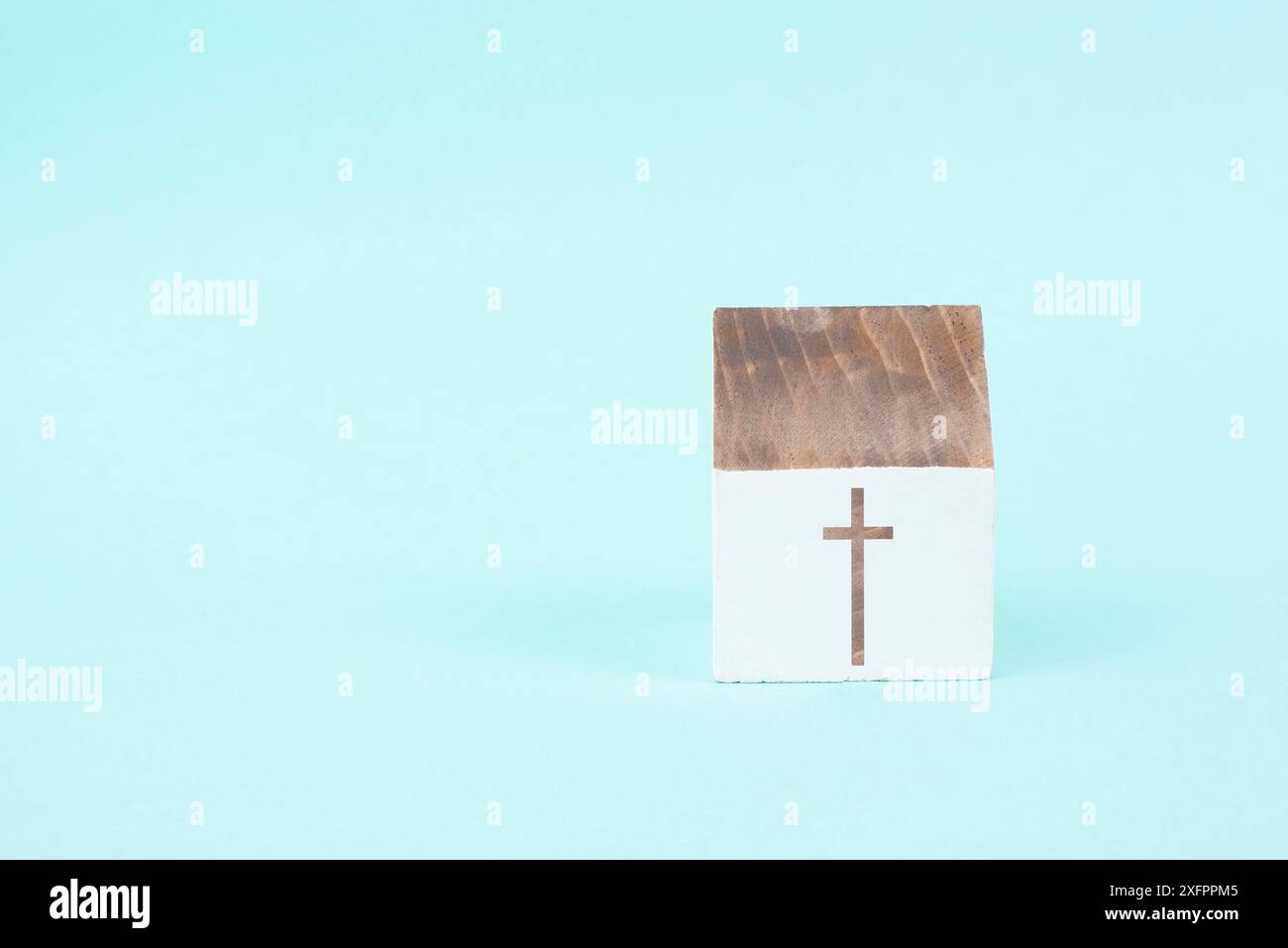 Wooden house with a religious cross, christian church, belief and faith ...