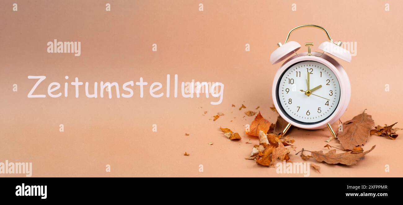 Alarm clock with autumn foliage, end of daylight saving time in fall ...
