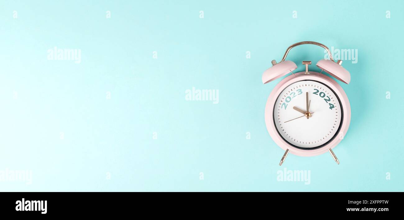 New year 2024 is loading, calendar date on an alarm clock, end of the ...
