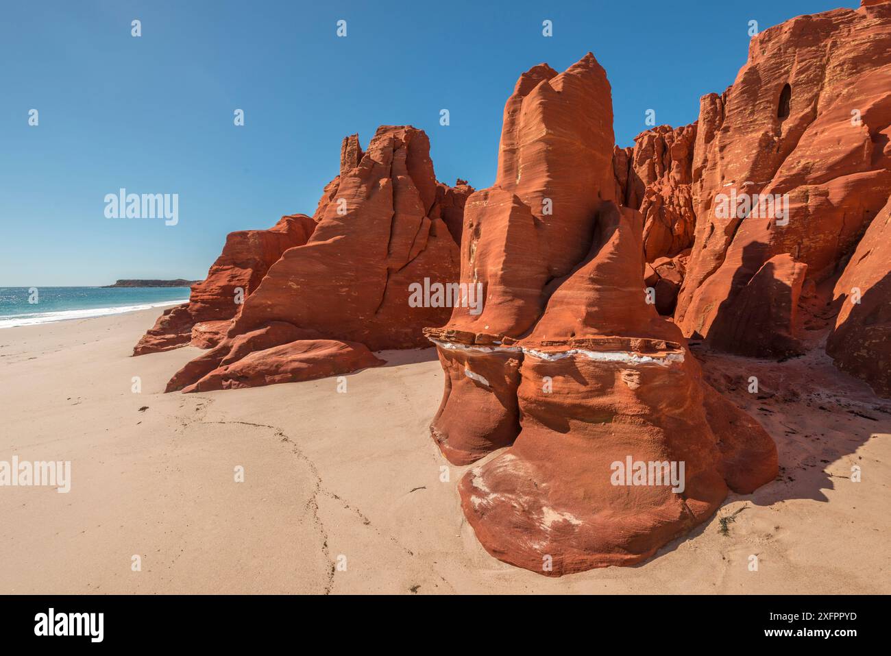 Spectacular views of ochre-coloured earth and sandstone cliffs, white ...