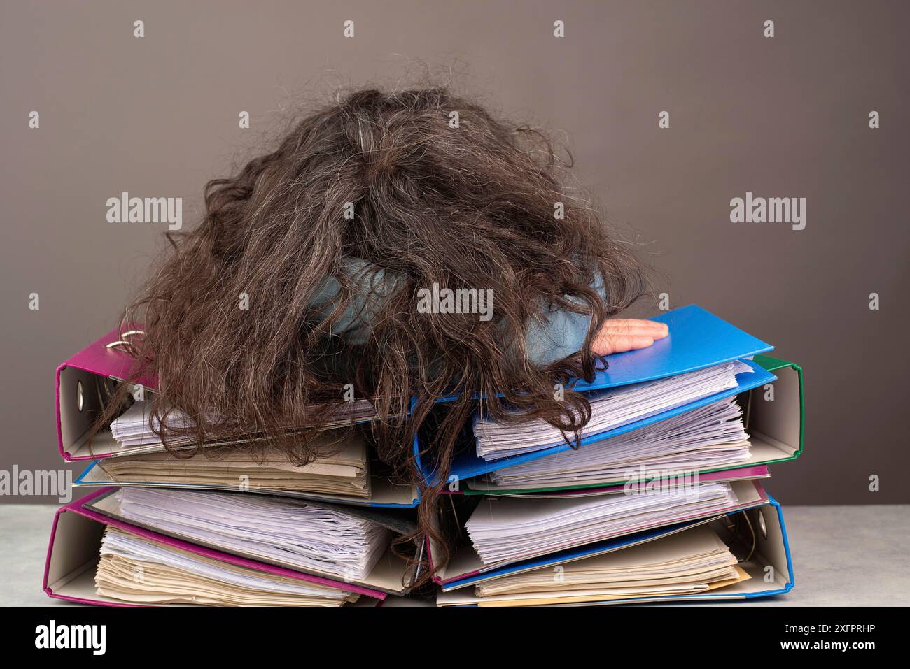 Exhausted tired woman sleeping on a pile of file folders, burnout ...