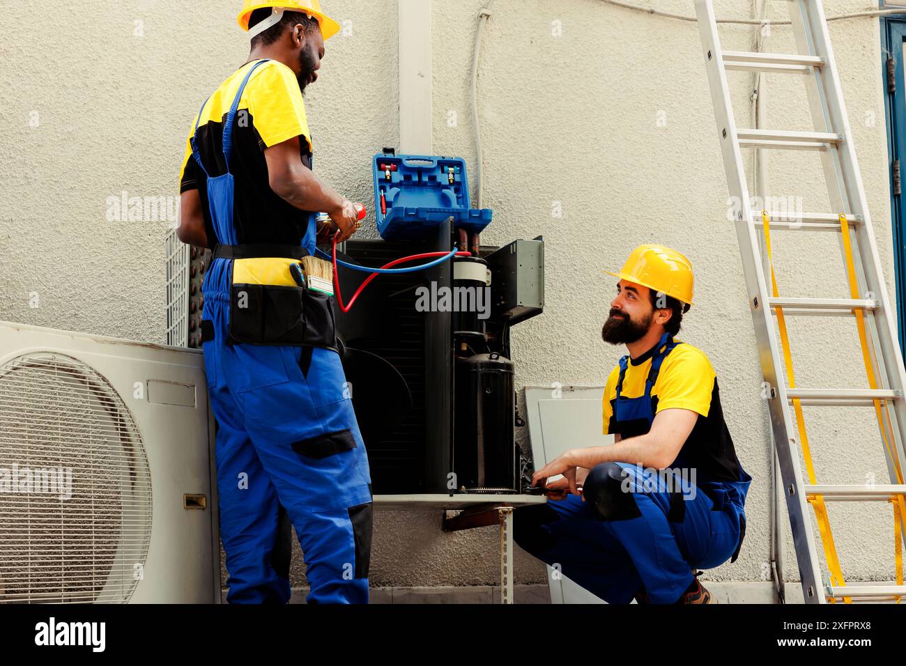 Servicemen fixing damaged blower fan causing frozen evaporator coil ...