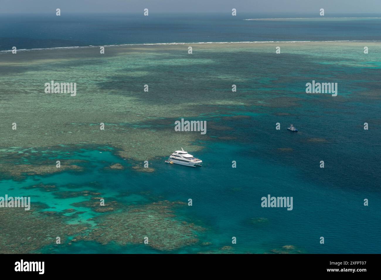 Aerials of the reefs of the Great Barrier Reef showing the tourist ...