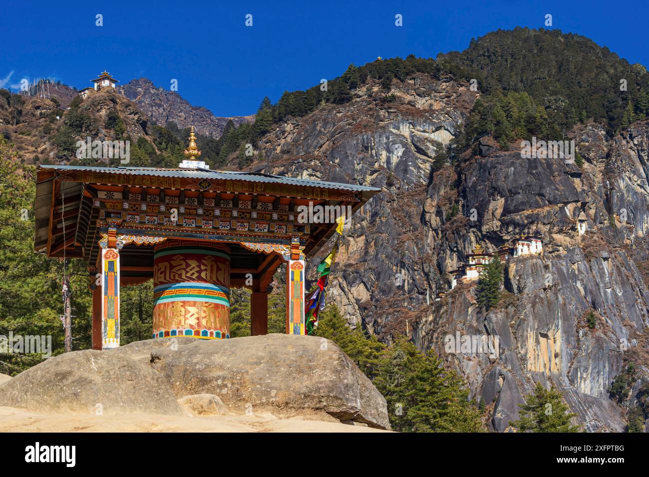 View of the Taktshang monastery in Paro with prayer wheel in the front ...