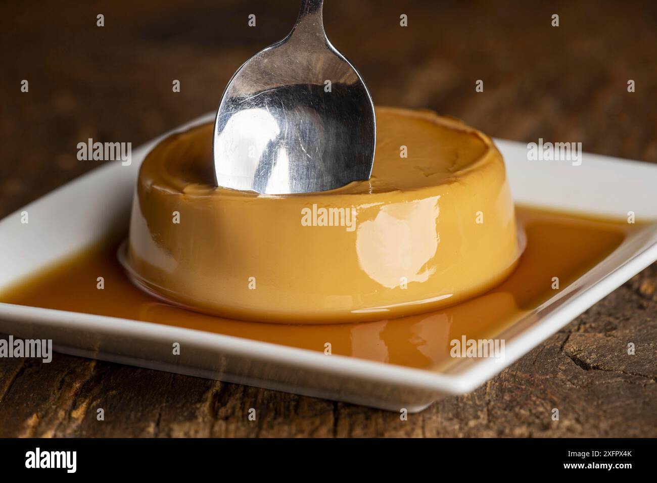 French flan on dark wood Stock Photo - Alamy