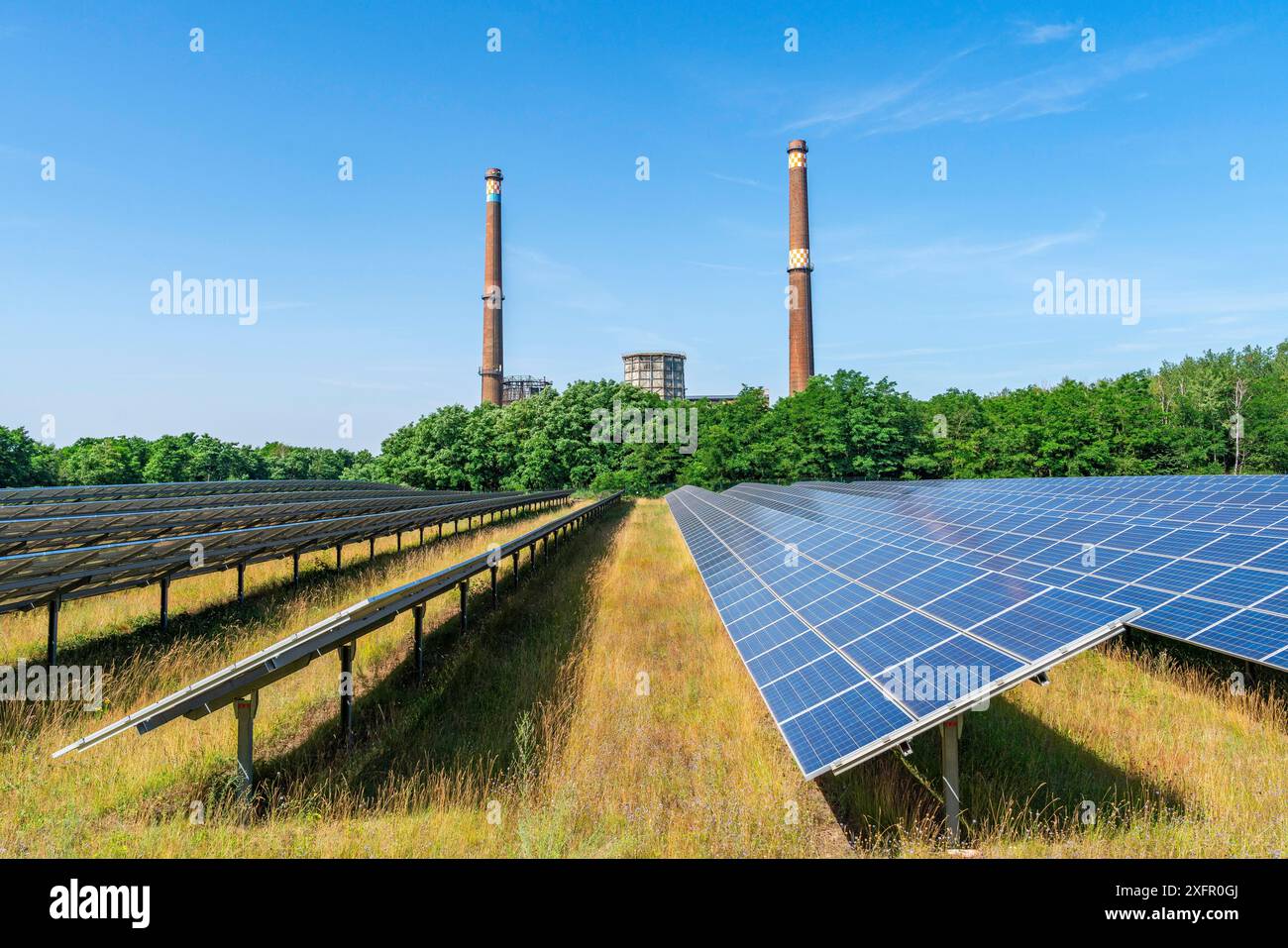 Solar modules of a solar park in front of the decommissioned Plessa ...