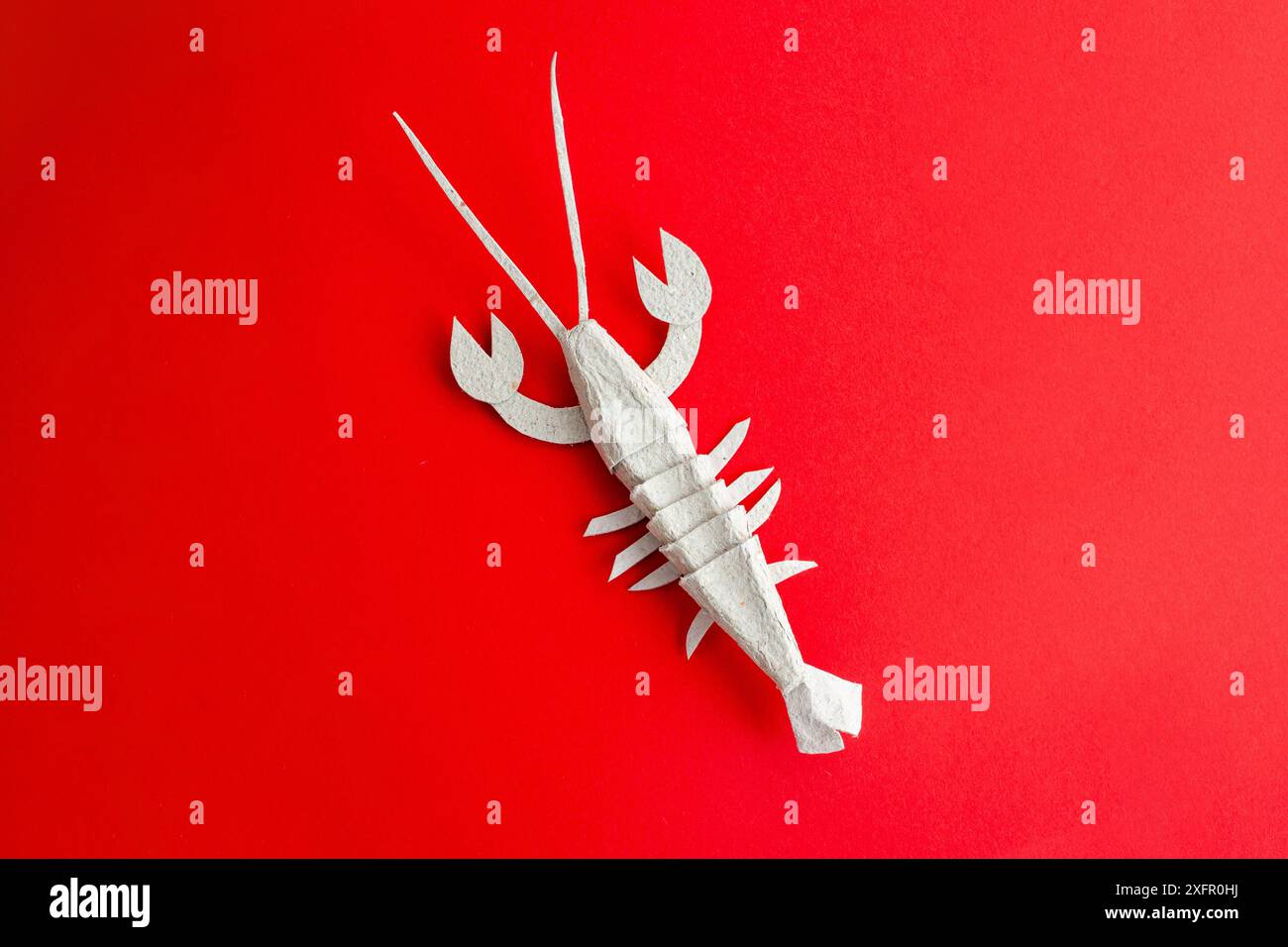 Close-up paper lobster on red surface. Folk art, highly detailed ...
