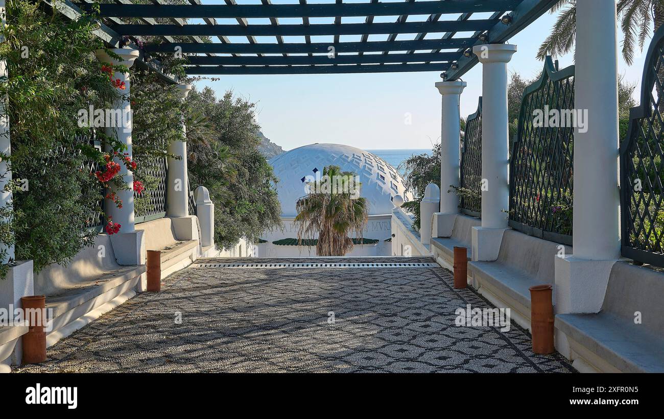 Pergola with columns and garden overgrown surroundings with sea view in ...