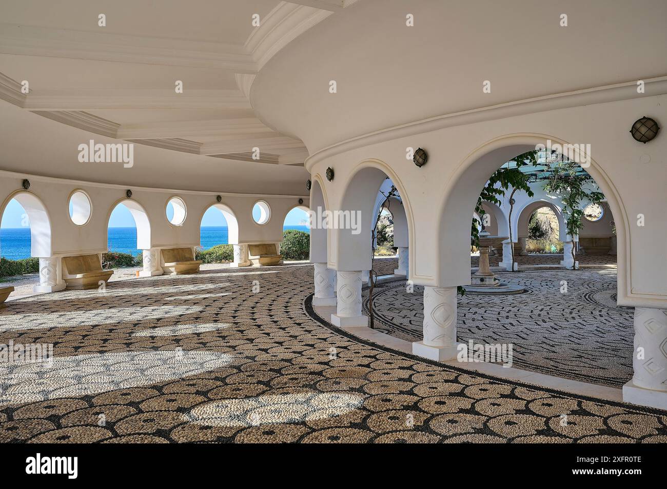 White round building with arches and ornate tiled floor, the interior ...