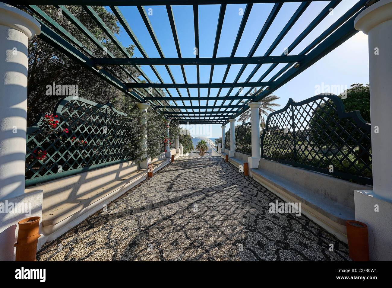 Covered walkway with pergola and geometric patterns, cast shade and ...