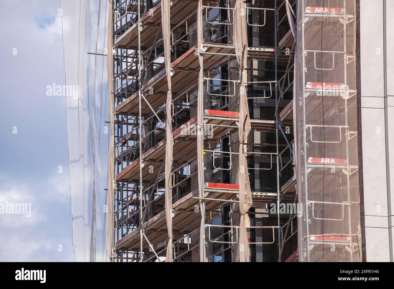 Construction site and shell of a residential building with scaffolding ...