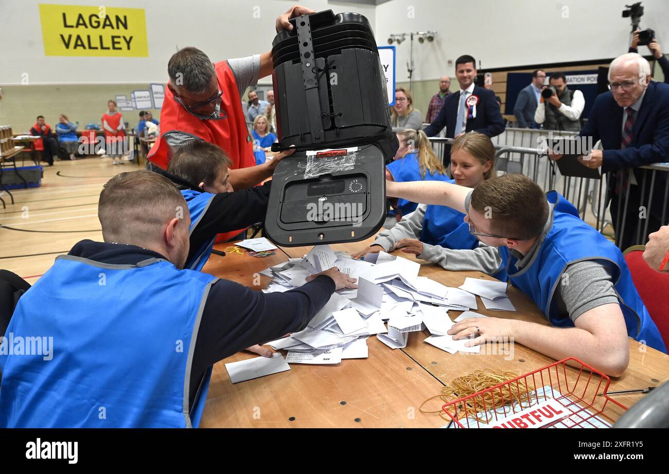 Voting slips are emptied from a ballot box at the Lagan Valley ...