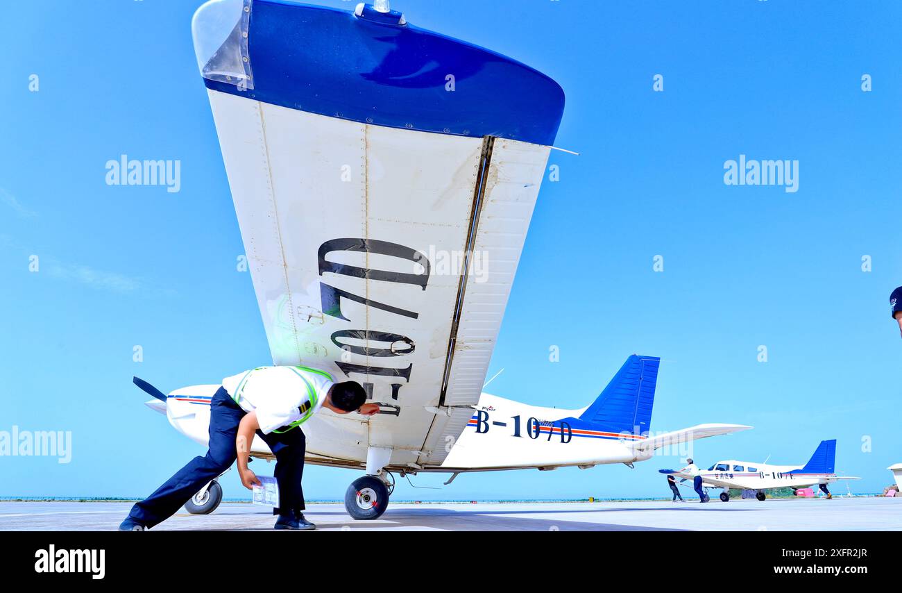 ZHANGYE, CHINA - JULY 4, 2024 - Flight cadets conduct safety checks ...