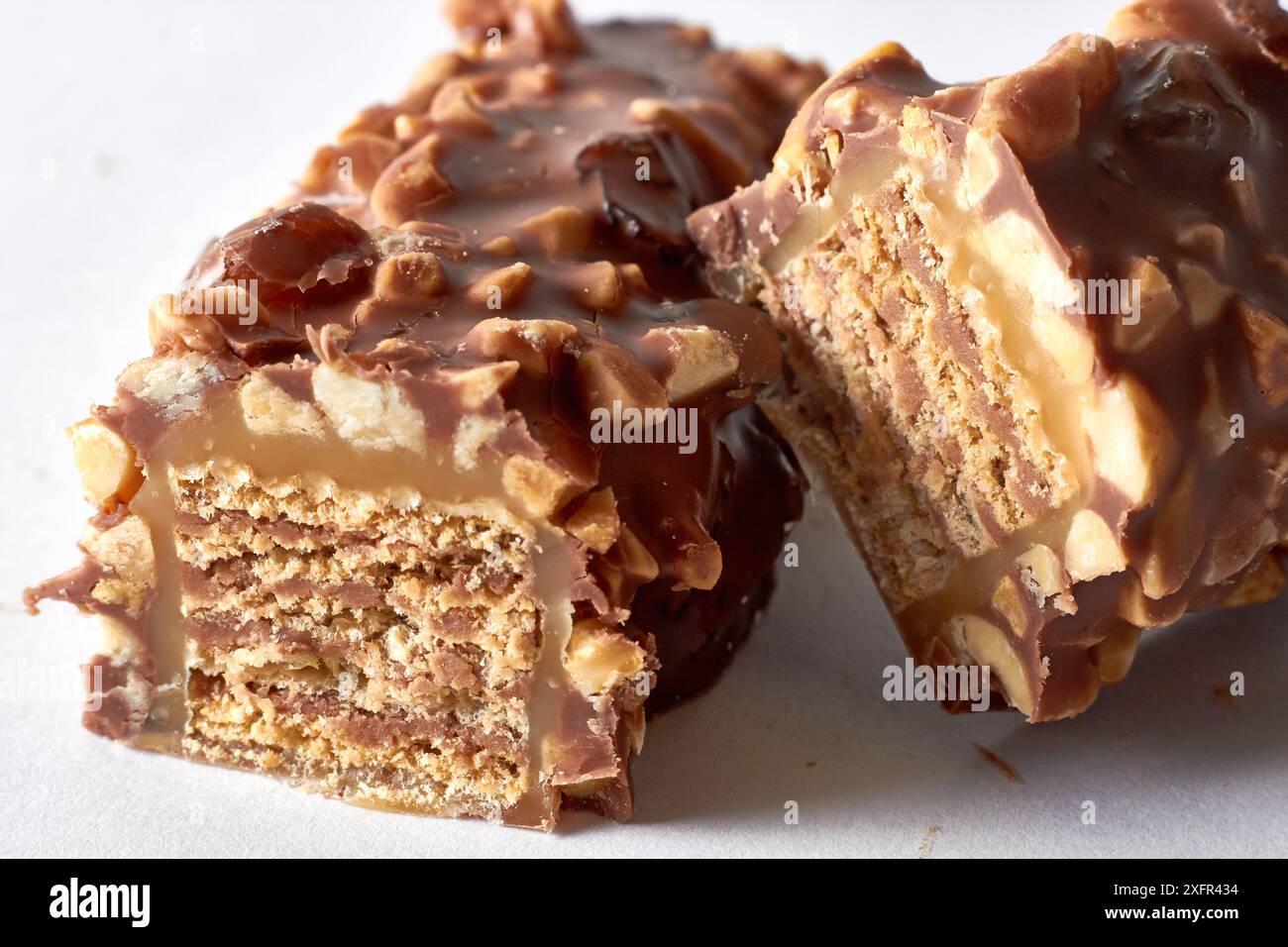 Sweet bar made from wafer covered with caramel and chocolate icing ...