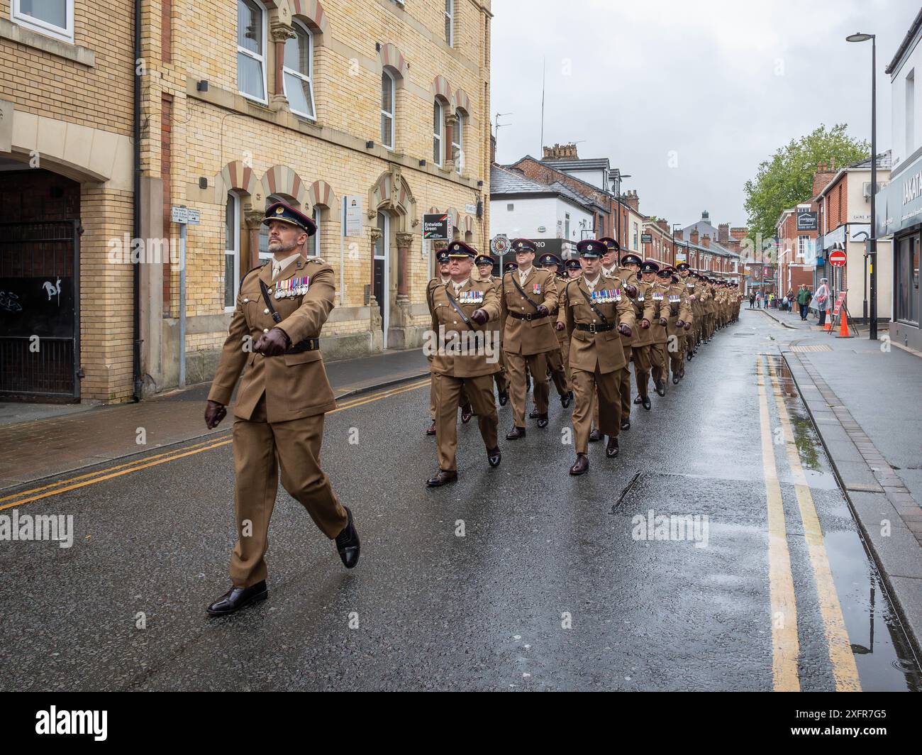 Military marching soldiers through town hi-res stock photography and ...