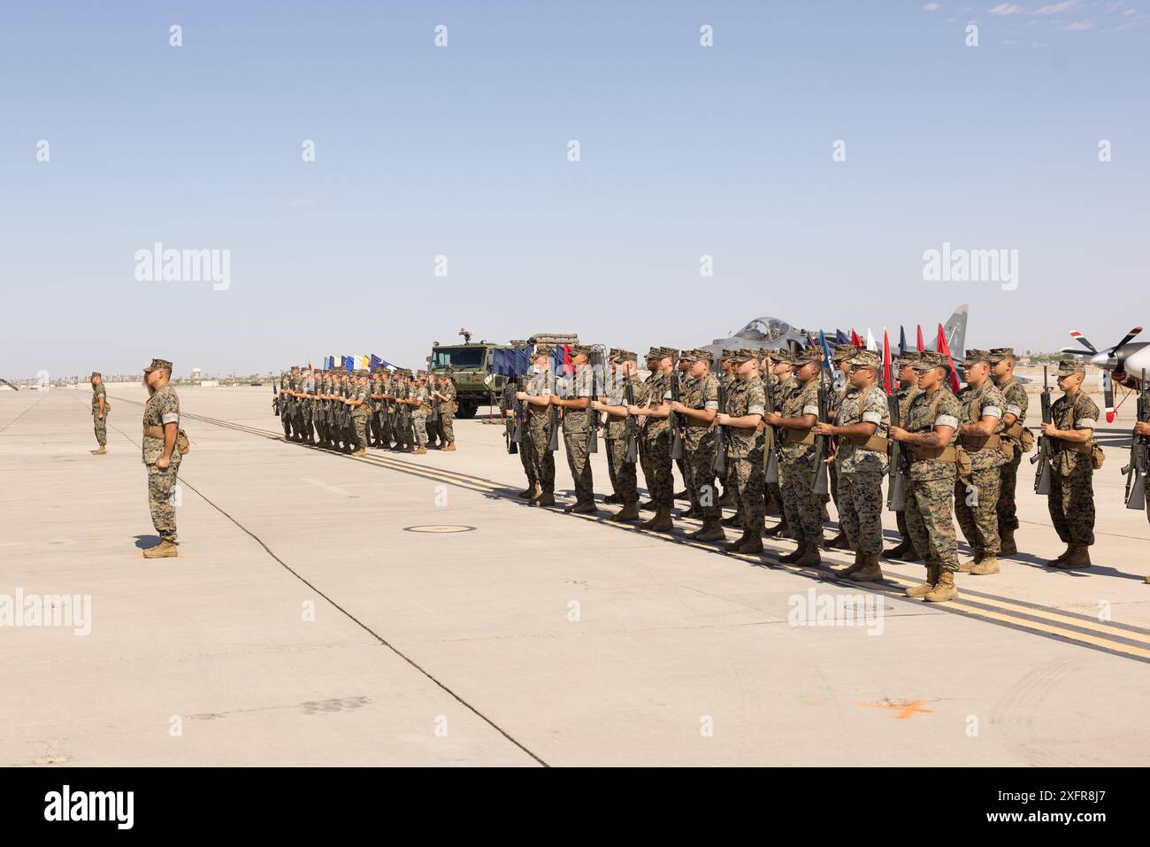 U.S. Marines with Headquarters and Headquarters Squadron (H&HS) stand ...