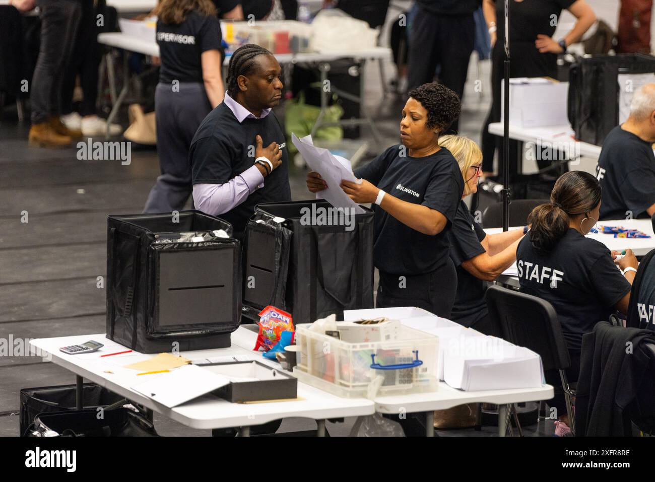 London, UK. 04 JUL, 2024. Counting office staffers begin counting votes ...