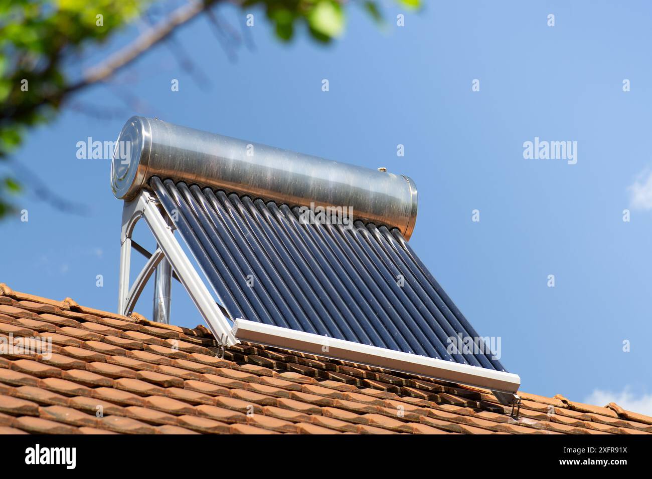 solar water heater on a roof top, solar water heating panel, blue sky ...
