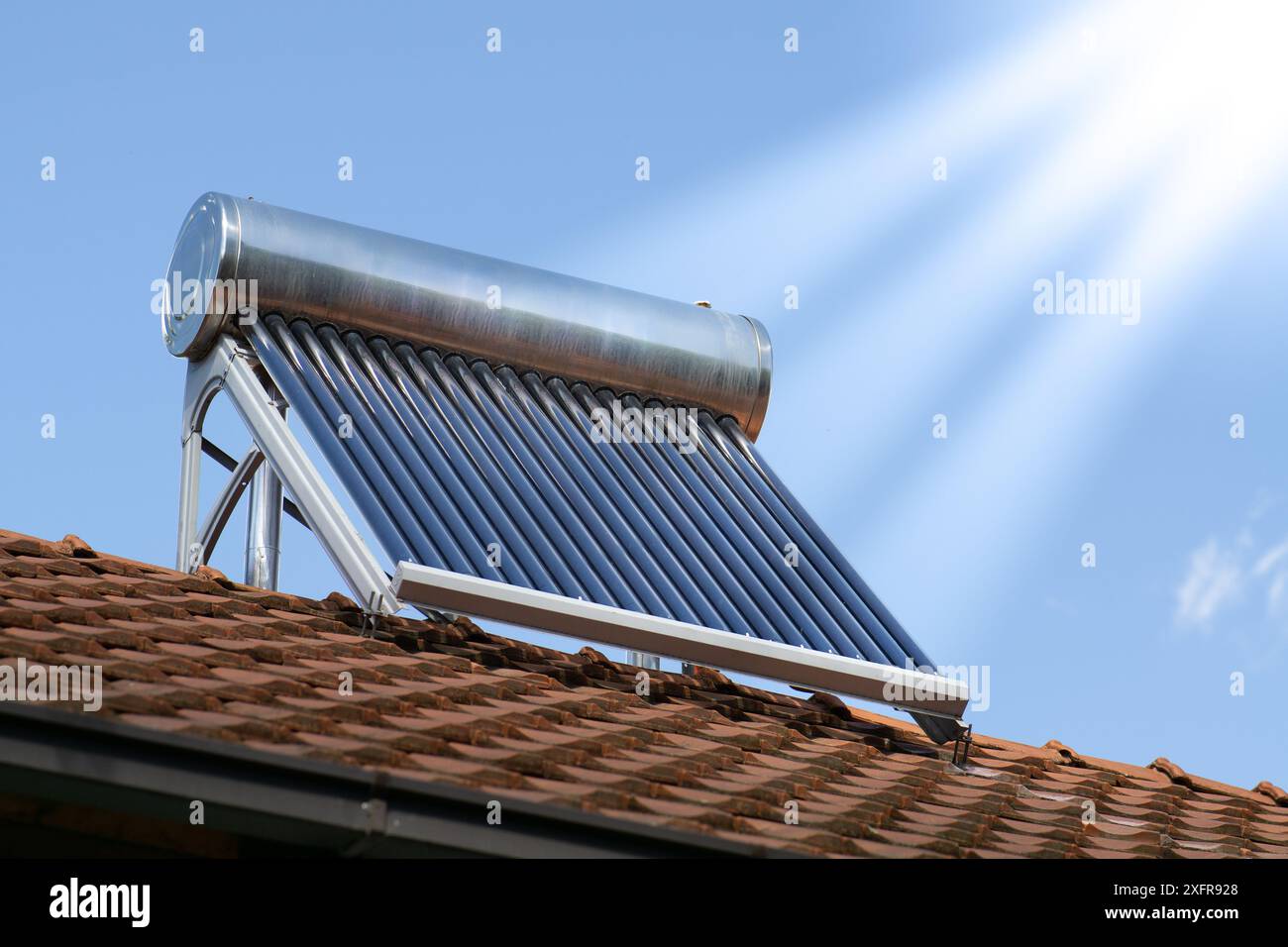 solar water heater on a roof top, solar water heating panel, blue sky in the background Stock ...