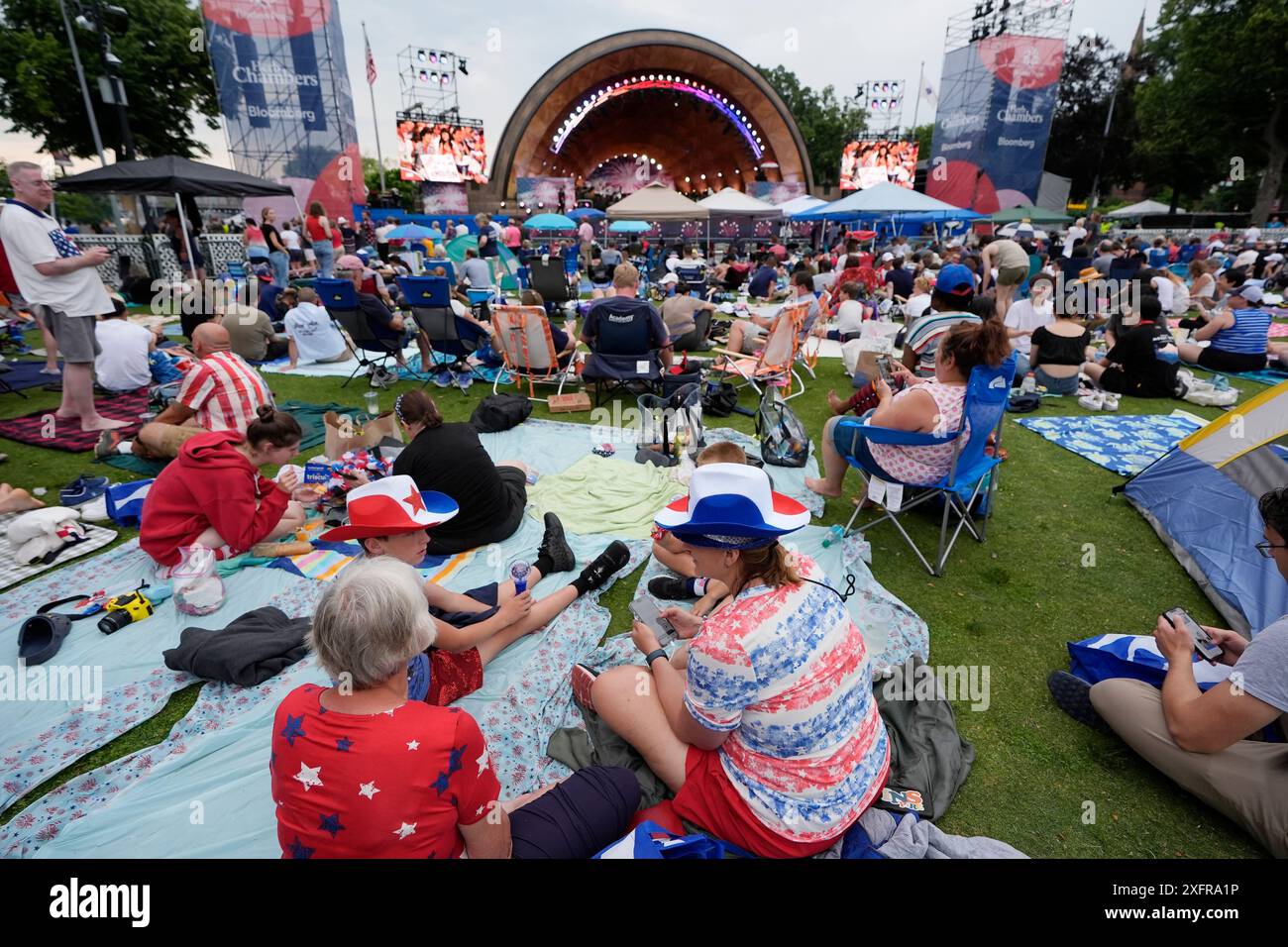 People wait for the start of the Boston Pops Fireworks Spectacular at ...