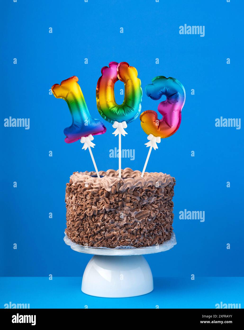 Air balloon number 103 - Birthday cake on blue background Stock Photo ...