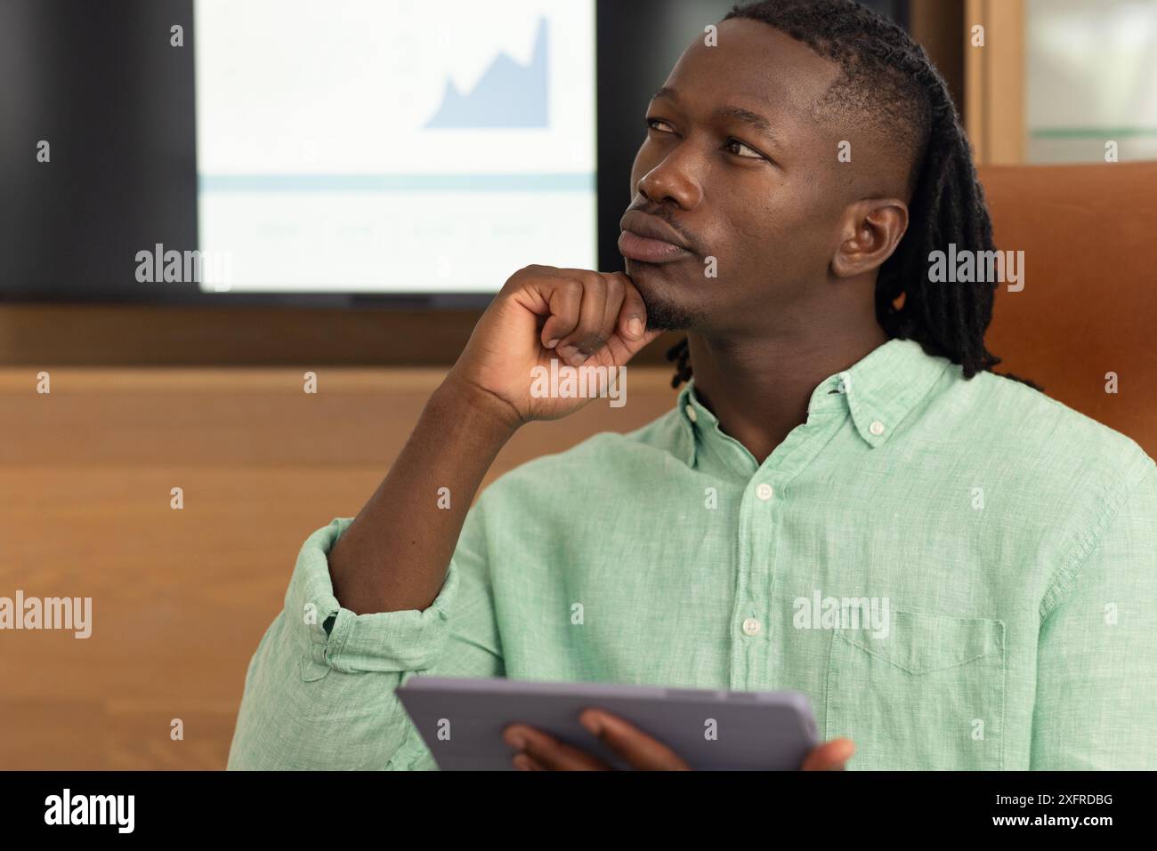 Thinking deeply, man holding tablet and analyzing data in office ...