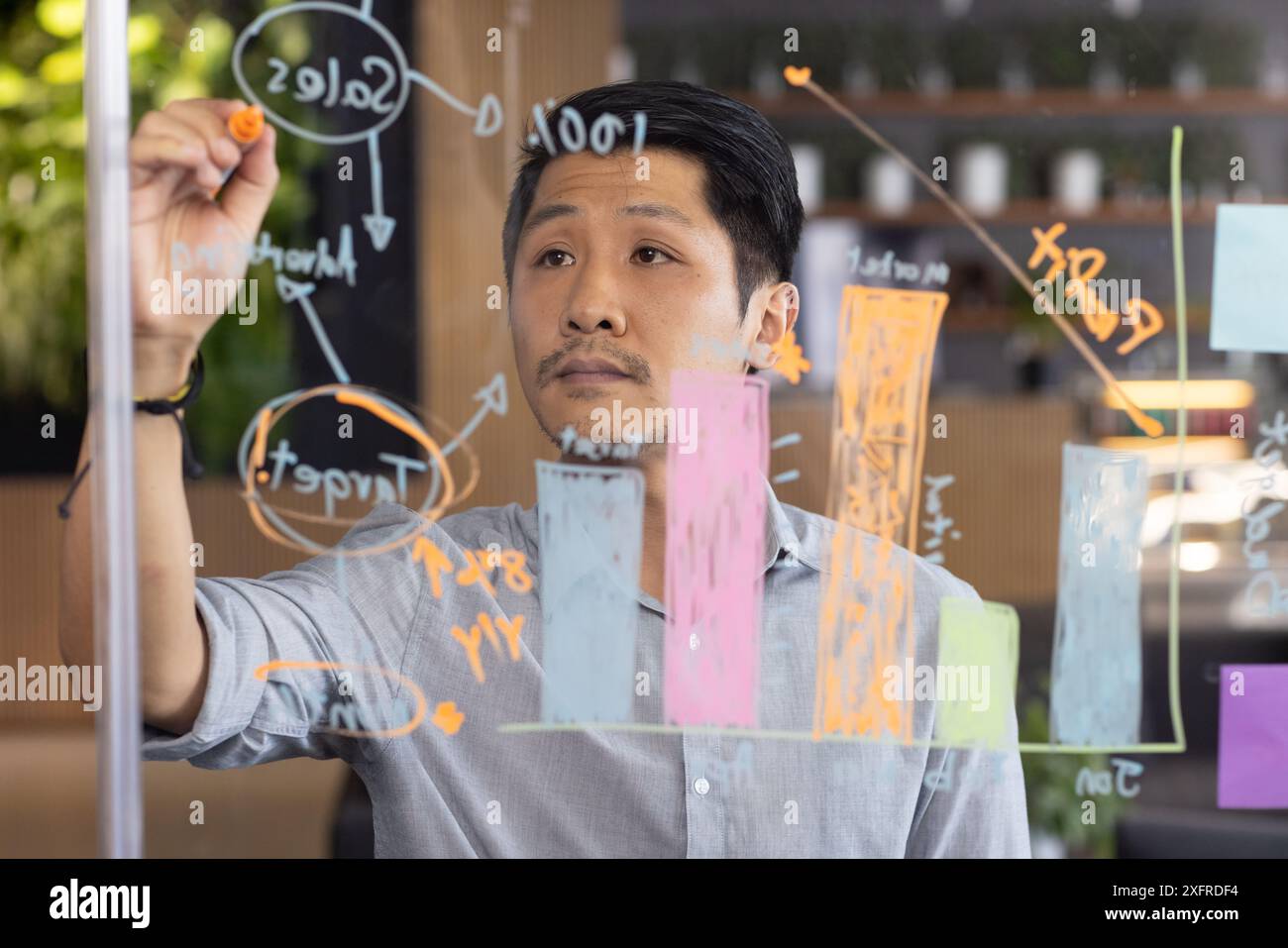 Businessman analyzing charts writing on hi-res stock photography and ...
