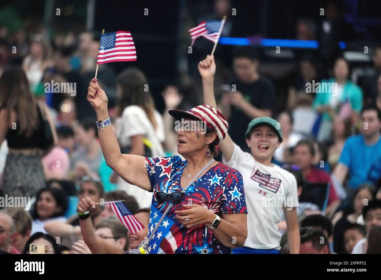 Spectators celebrate during the Boston Pops Fireworks Spectacular at ...