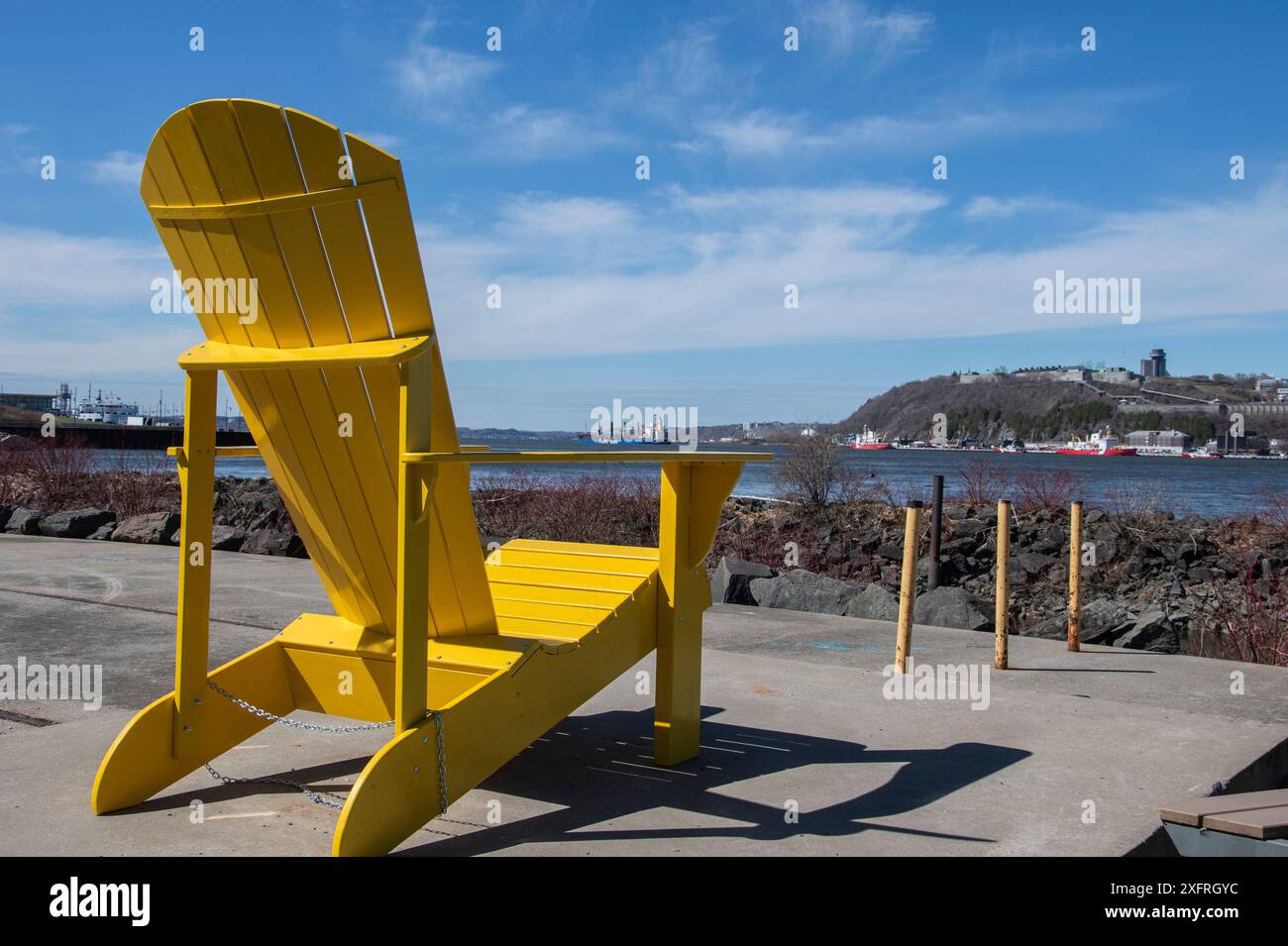 Yellow Adirondack chair with a view of Quebec City at Quai Paquet in ...