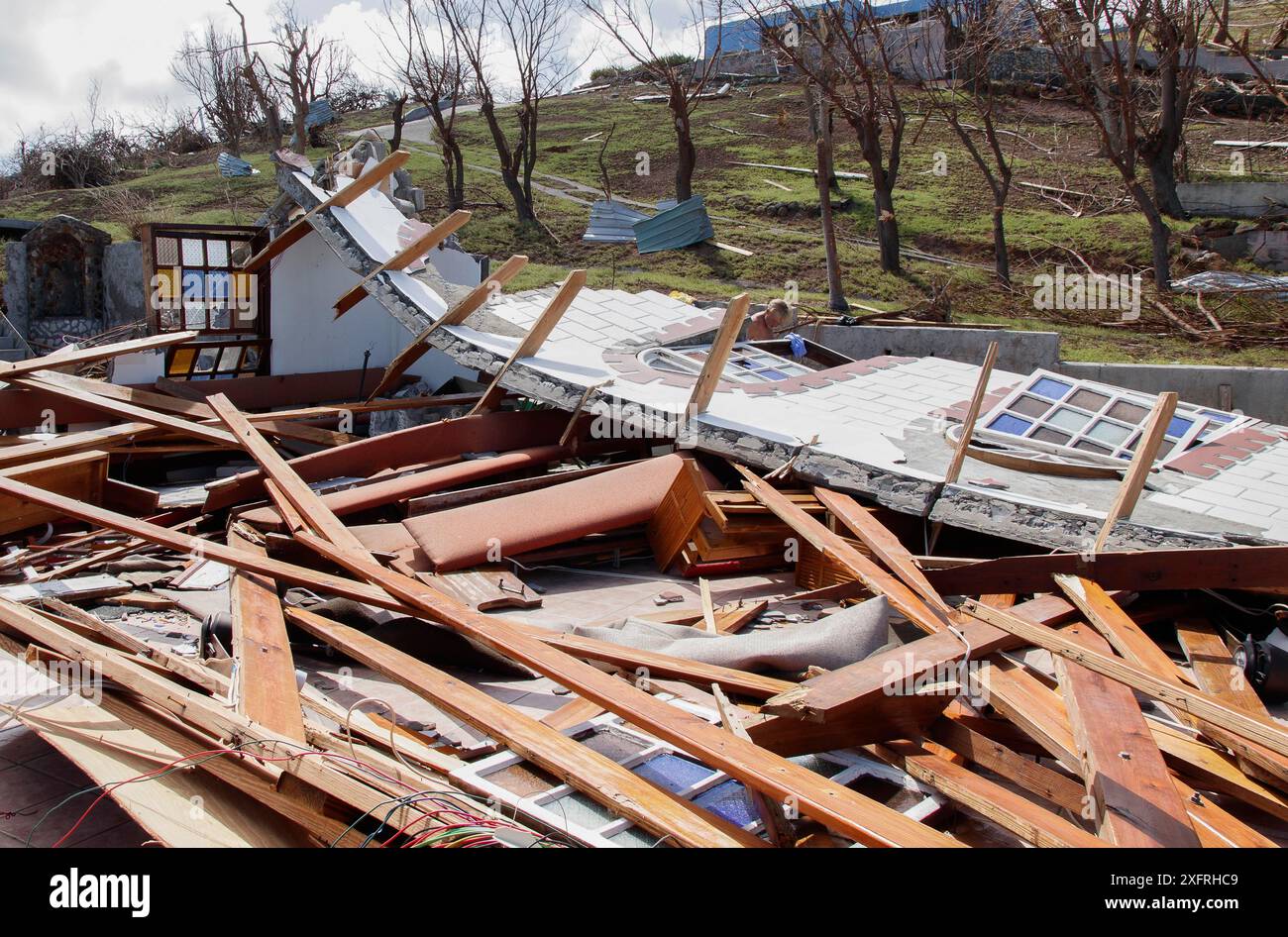 A man inspects a home destroyed by Hurricane Beryl in Clifton, Union ...