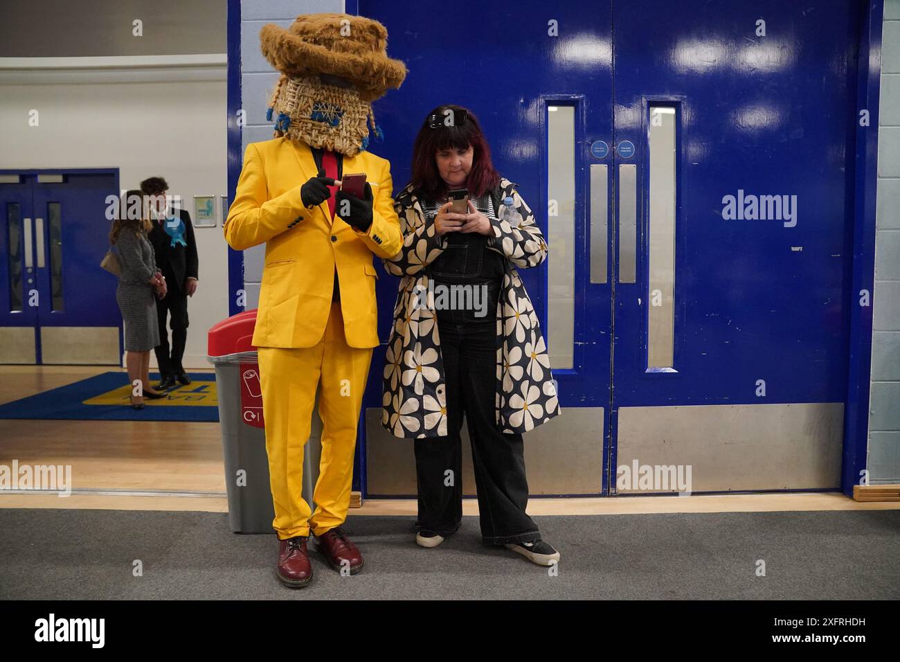 Bill Blockhead (left), an independent candidate, view results on a ...