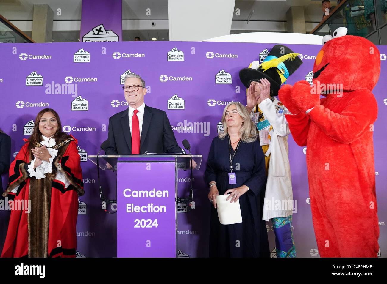 Labour leader Sir Keir Starmer (left) gives a victory speech watched by ...