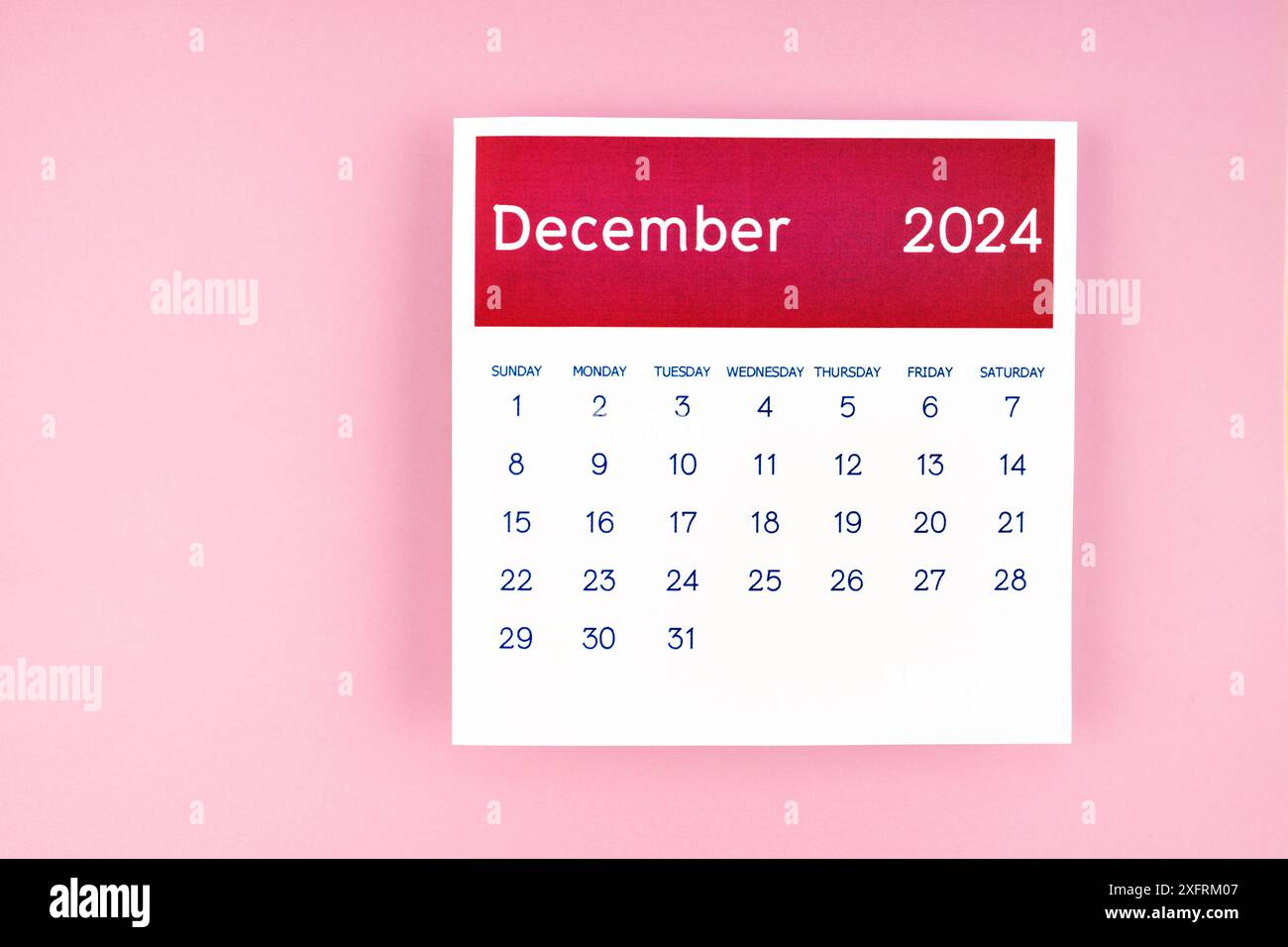 calendar page December 2024 on pink color background Stock Photo - Alamy