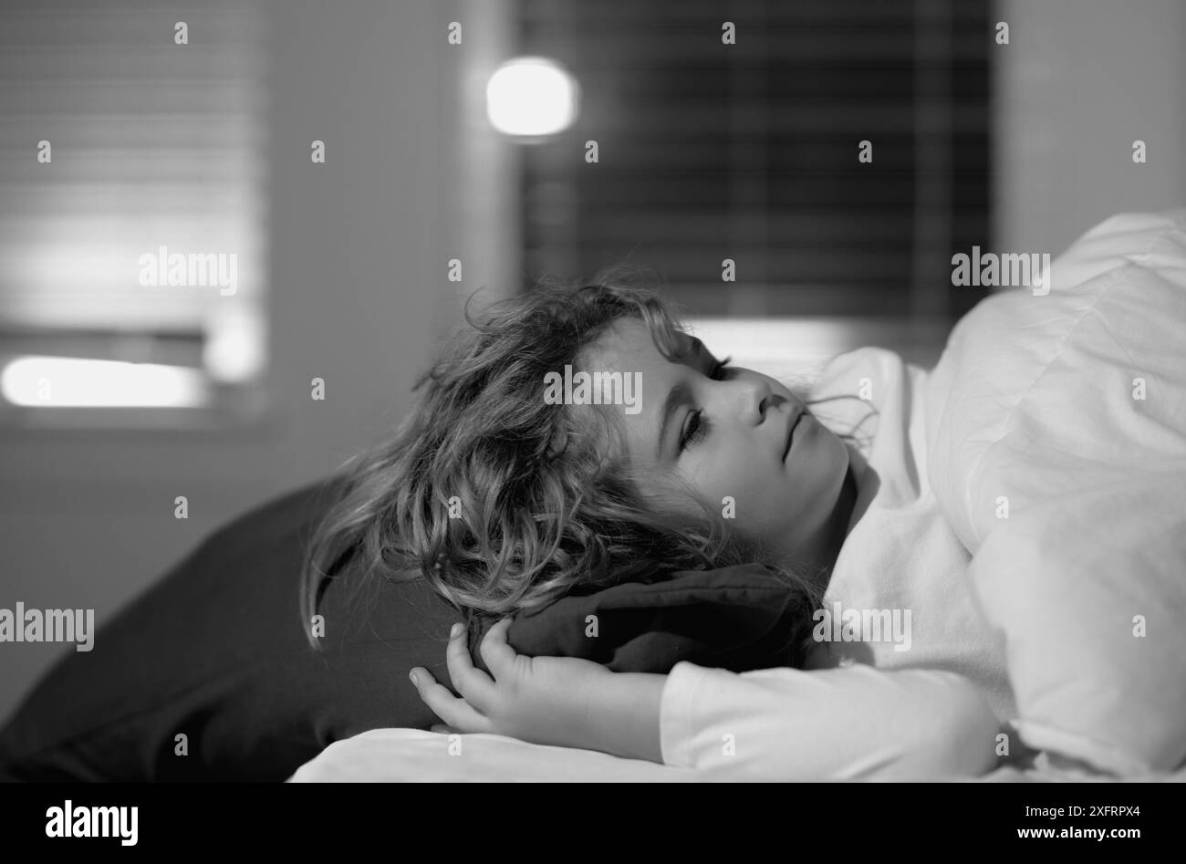 Boy child asleep bed Black and White Stock Photos & Images - Alamy