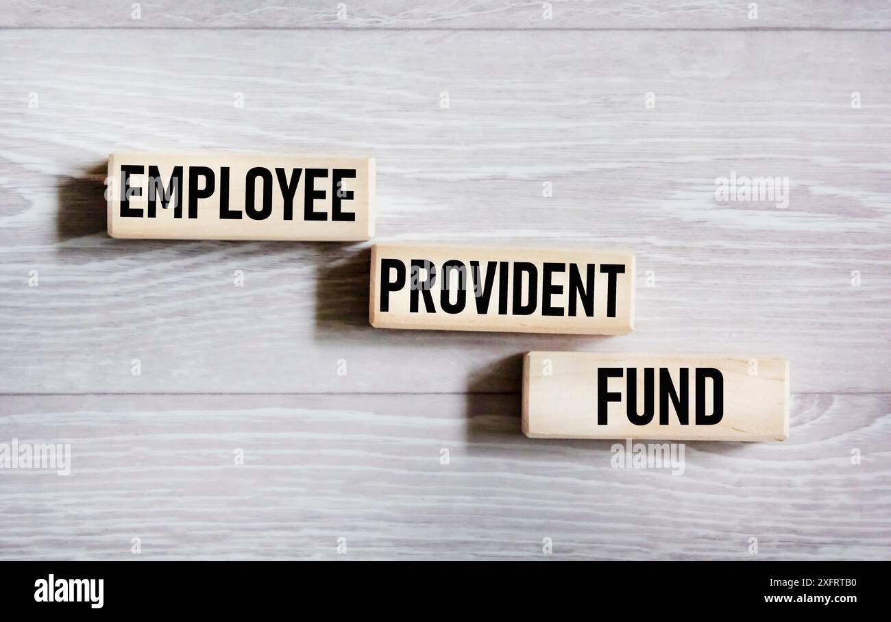 Wooden blocks with the inscription Employees' Provident Fund. Beautiful gray background, copy ...
