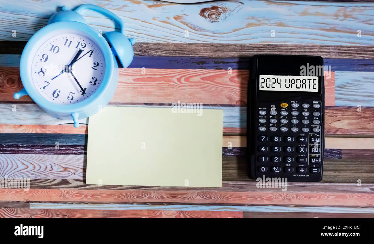 Calculator with 2024 UPDATE on display. Financial services concept ... Calculator with 2024 UPDATE on display. Financial services concept ...