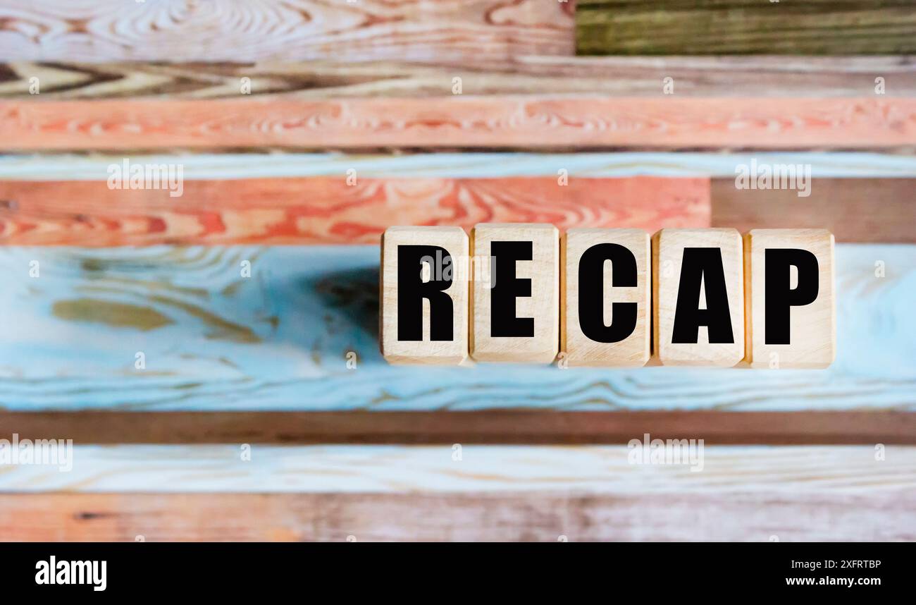 Recap word from wooden blocks on desk Stock Photo - Alamy