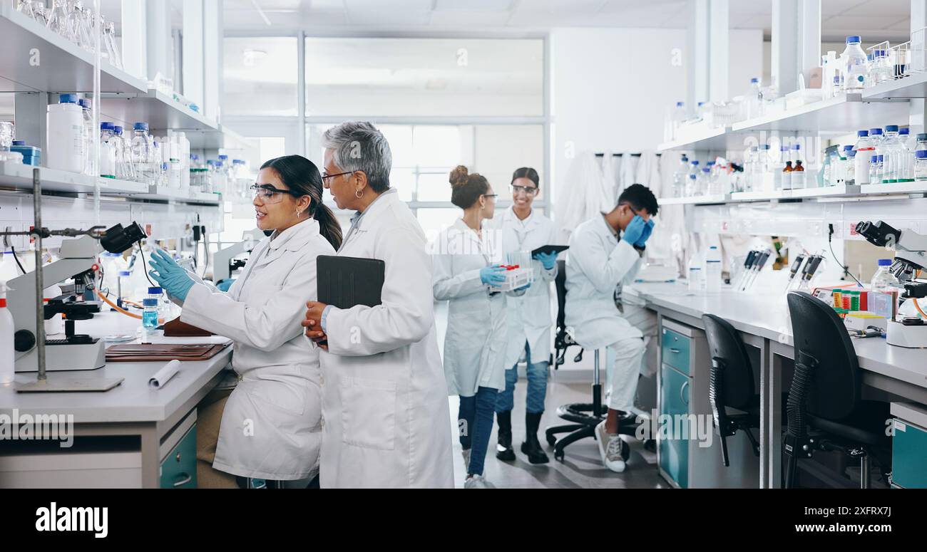 Diverse group working on experiment hi-res stock photography and images ...
